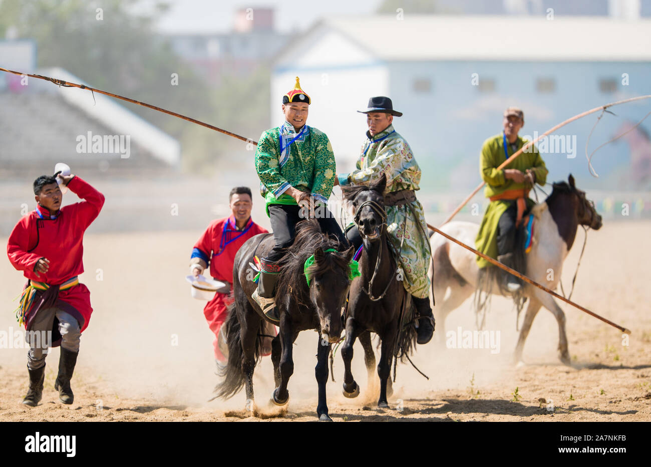 Chinese equestrians take part in a horse training contest in Huhhot ...