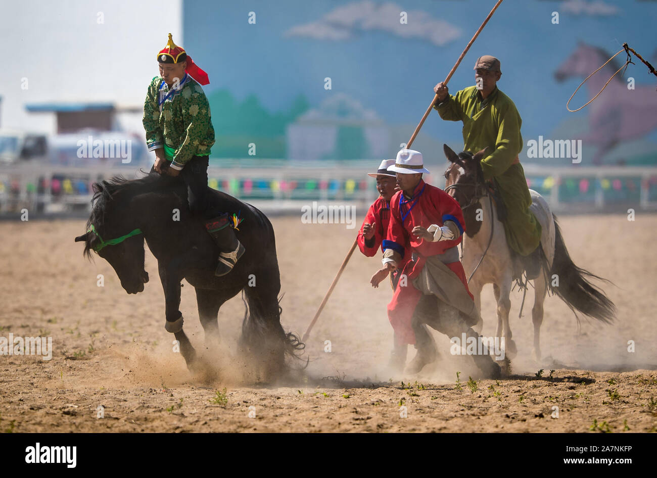 Chinese equestrians take part in a horse training contest in Huhhot ...