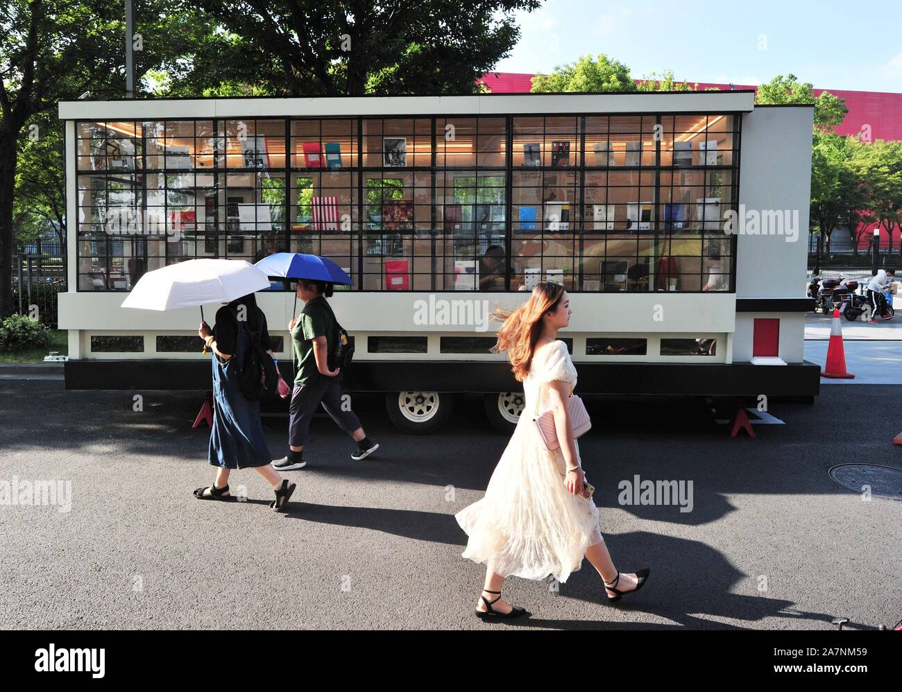 Pedestrians walk past the Bauhaus caravan Wohnmaschine during the ...