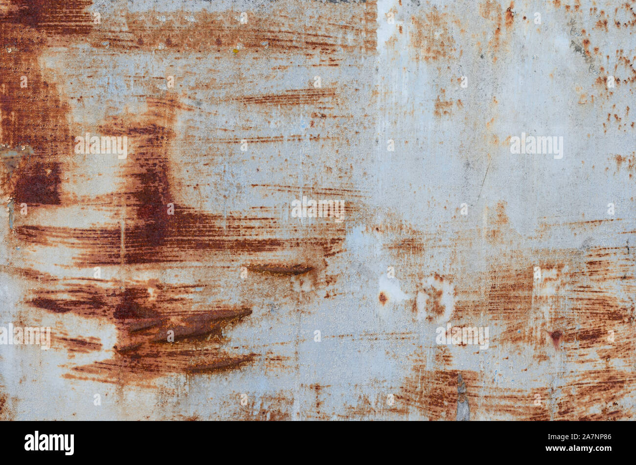Old rusty piece of banner .Textured empty abandoned street advertising ...