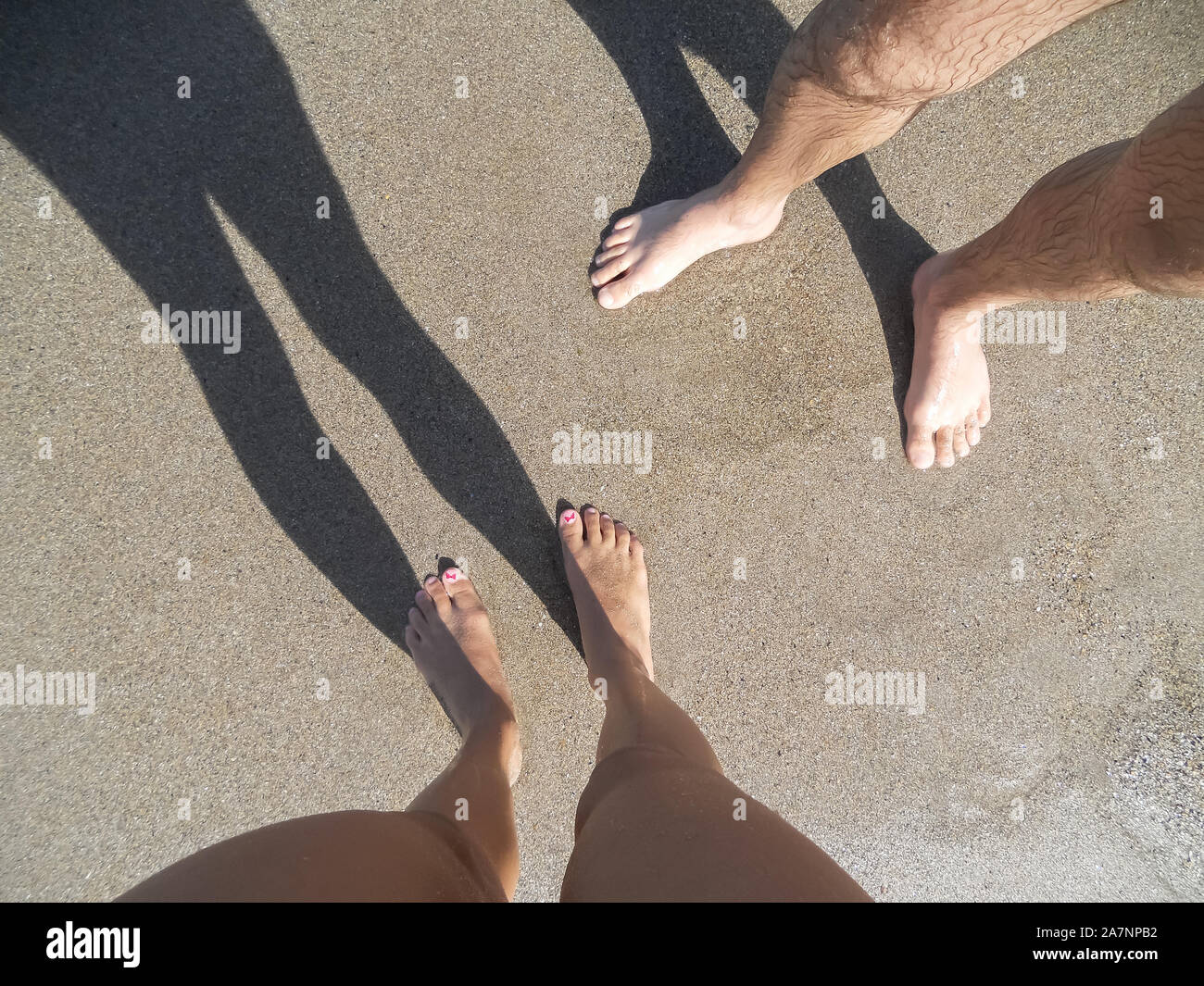 Human shadows on a beach hi-res stock photography and images - Alamy