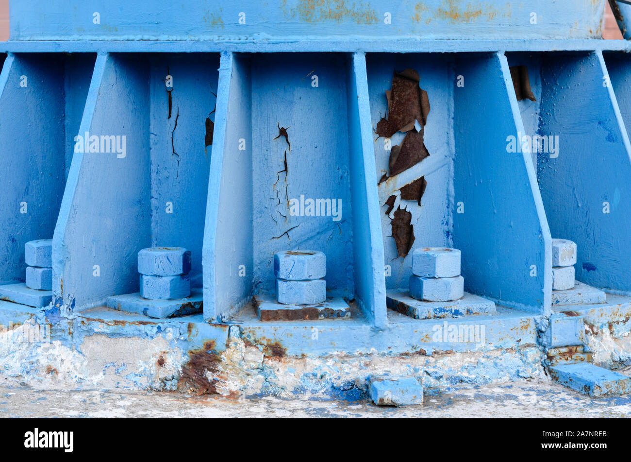 Close up of blue bolts and nuts used for hold the base structure of ...