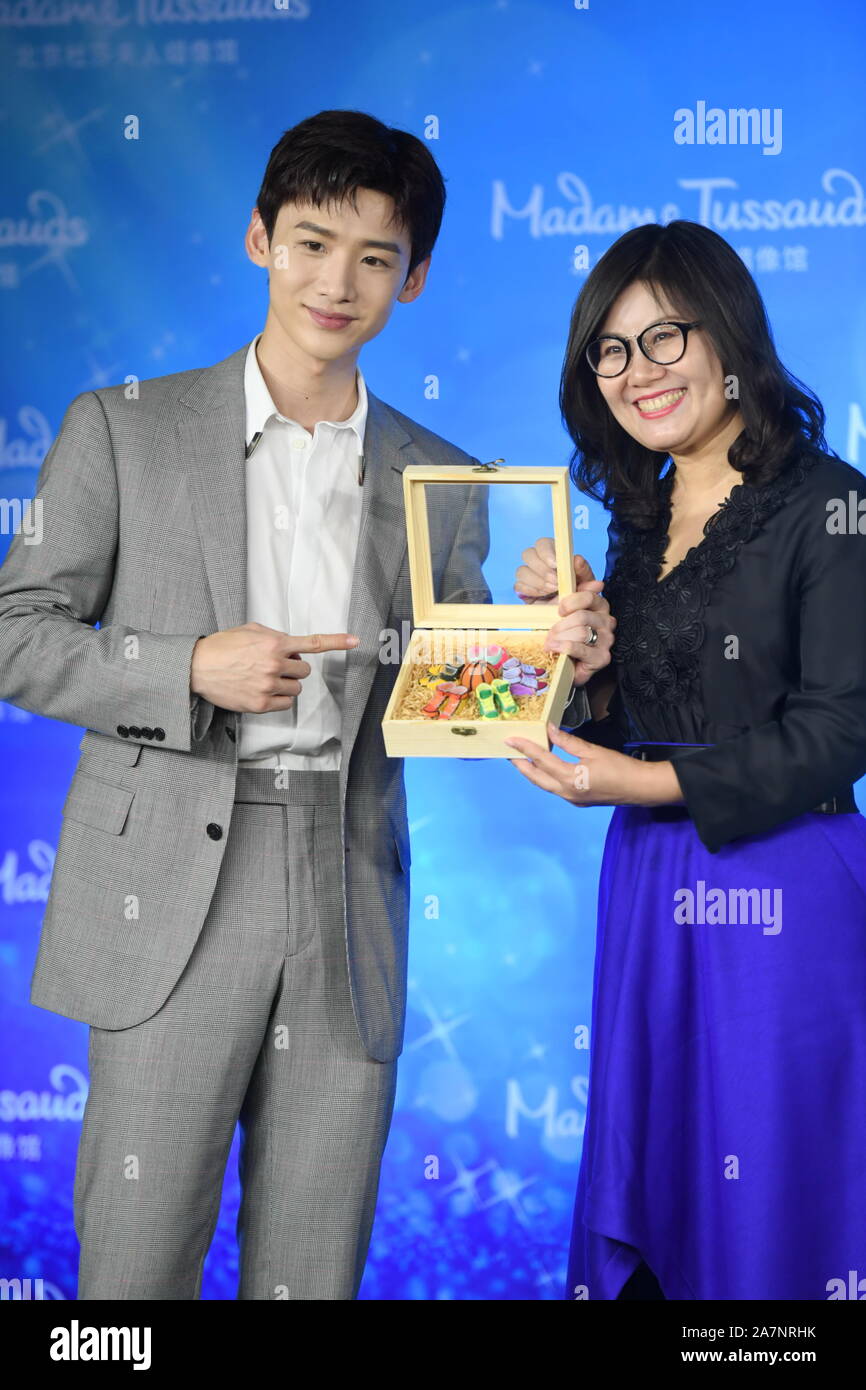 Chinese actor Bai Jingting, left, attends an unveiling ceremony for his ...