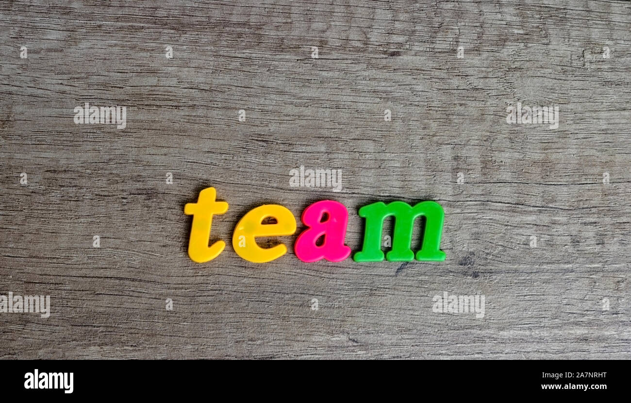 Team sentence written with plastic letters on a wooden table Stock ...