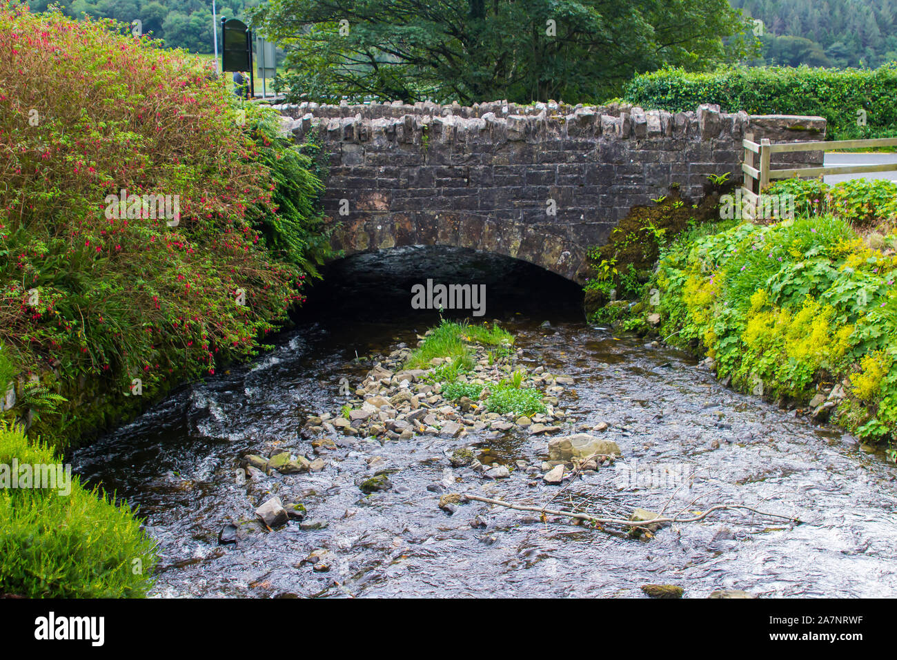 23 August 2019. The small bridge over the fast running river at the ...