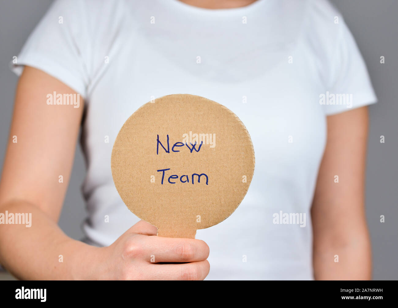 Women hand with paddles shape cardboard paper homemade with handwritten ...