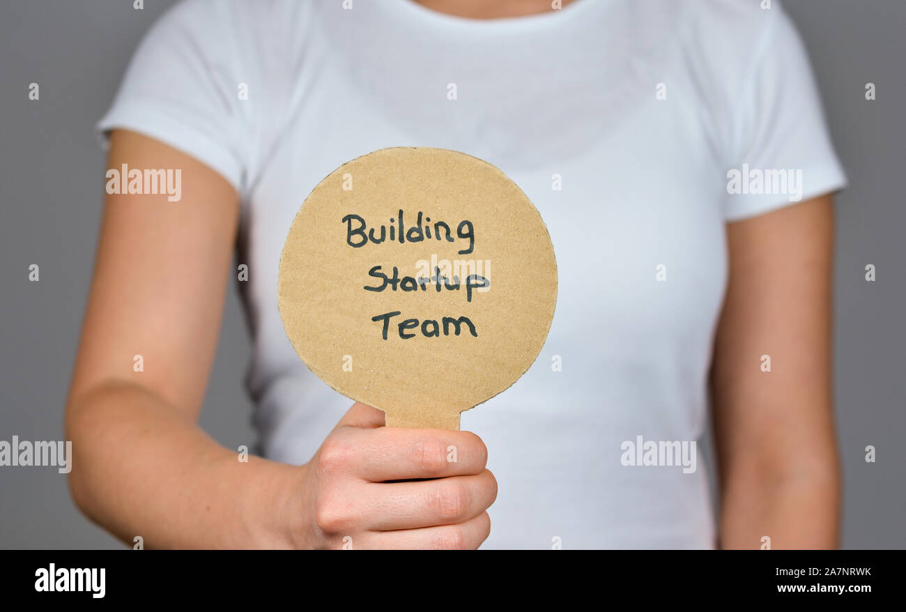 Women hand with paddles shape cardboard paper homemade with handwritten ...