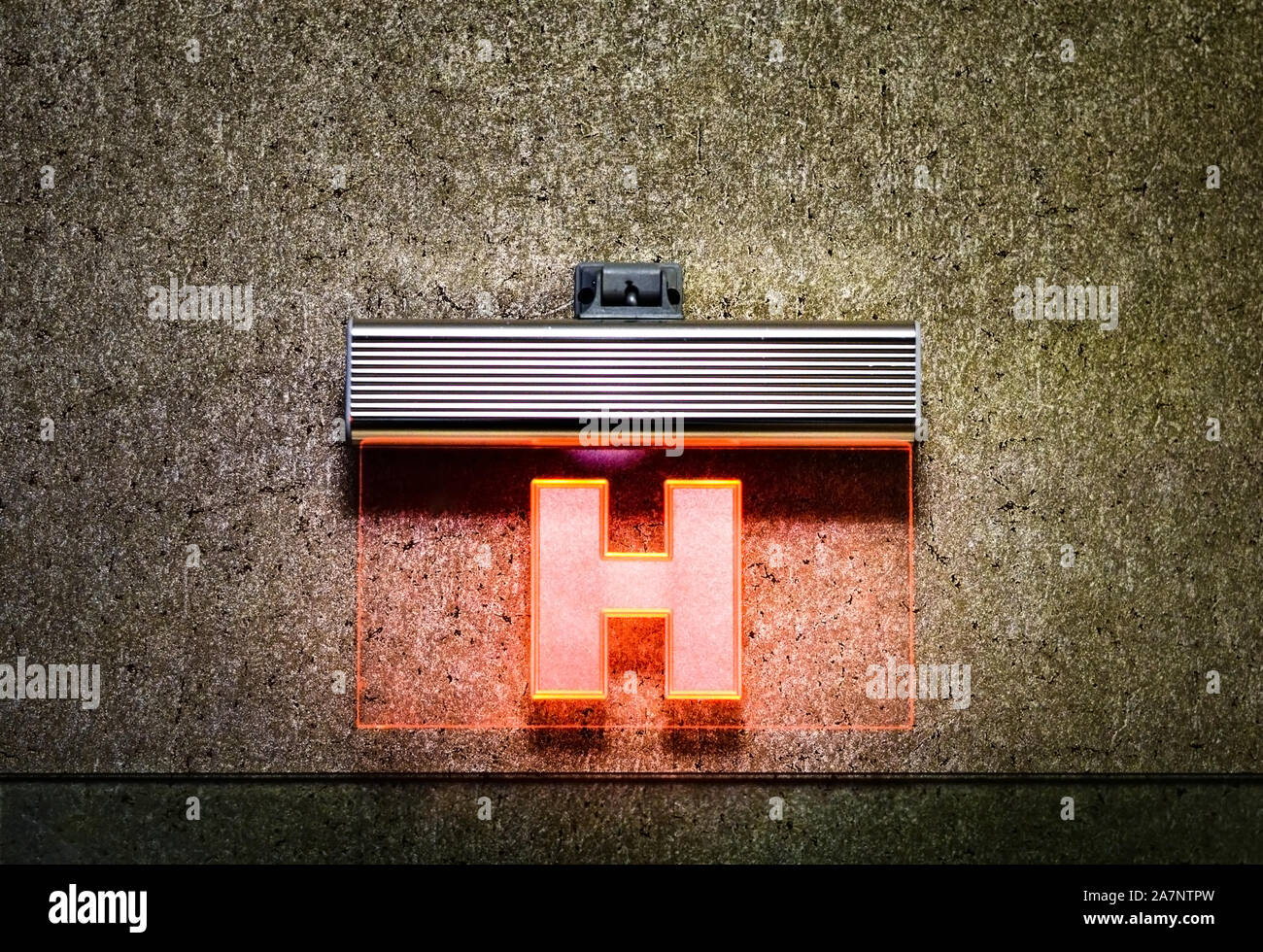 Fire hydrant sign with glowing red lights on glass hanging on marble ...
