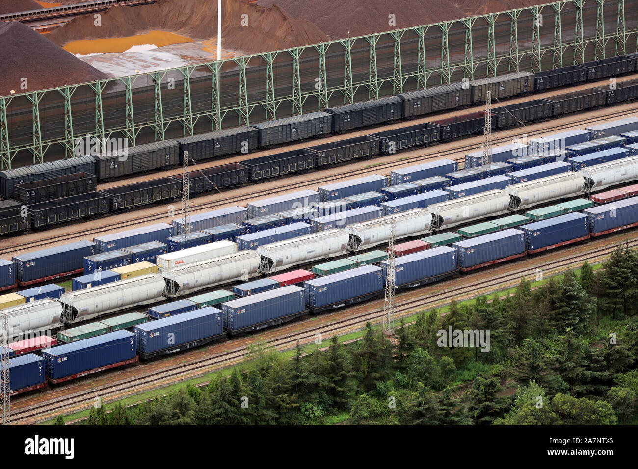 Cargo trains loaded with containers to be shipped abroad are parked at ...