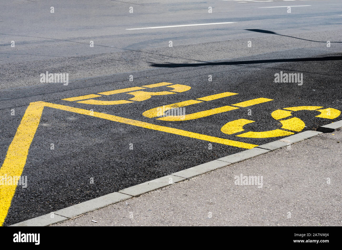 Bus stop station yellow sign on street Stock Photo - Alamy