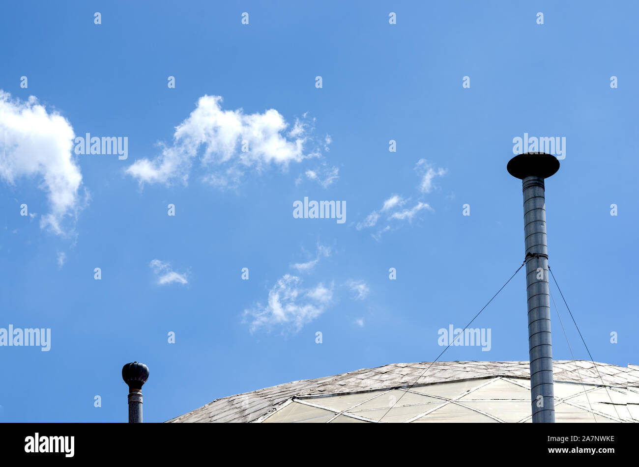Low angle view stainless steel domestic chimney agains blue sky Stock ...