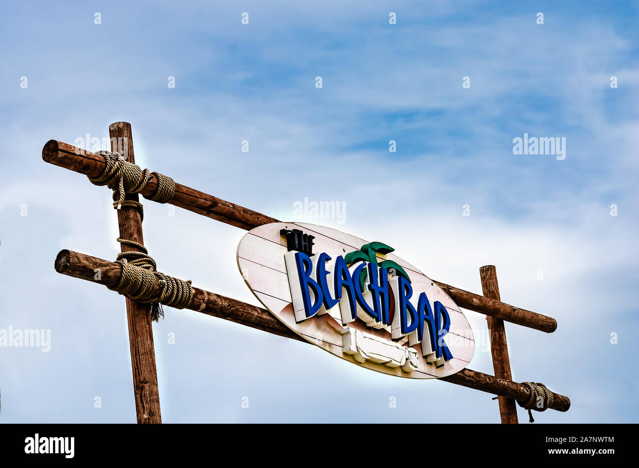 Welcome to the beach bar banner written with blue letters at the ...