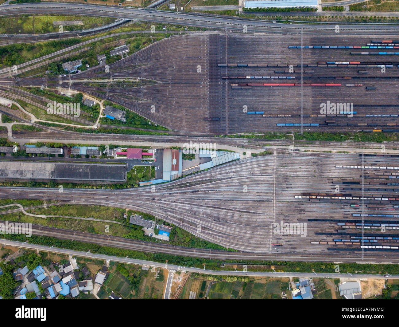 An aerial view of railway trains parked at a classification yard or ...