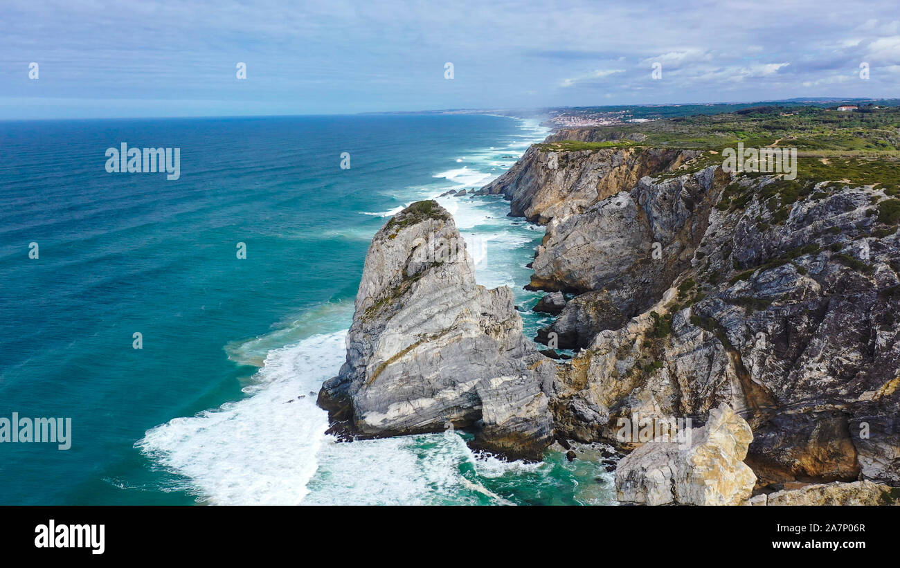 The rocky beach of Cabo da Roca in Portugal at sunset - aerial drone ...