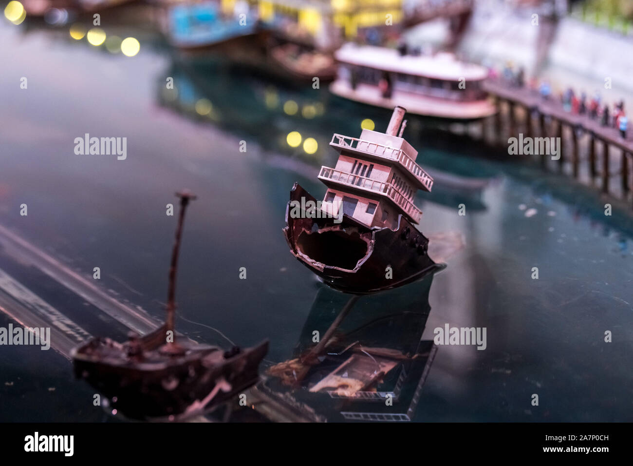 View of the miniature artworks capturing a sunken ship on display ...