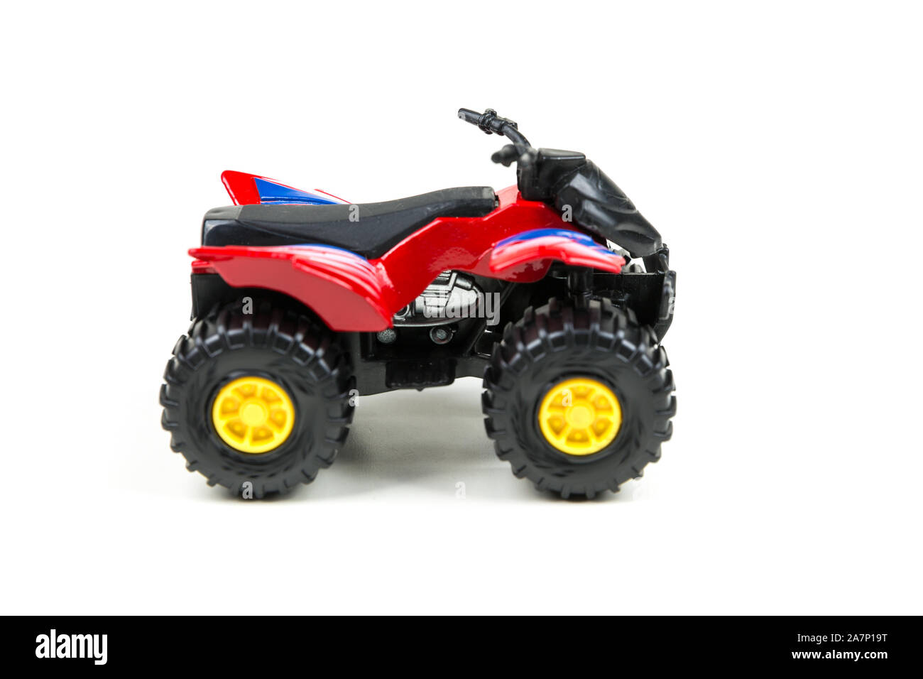 Red toy plastic quad atv on a white background Stock Photo - Alamy
