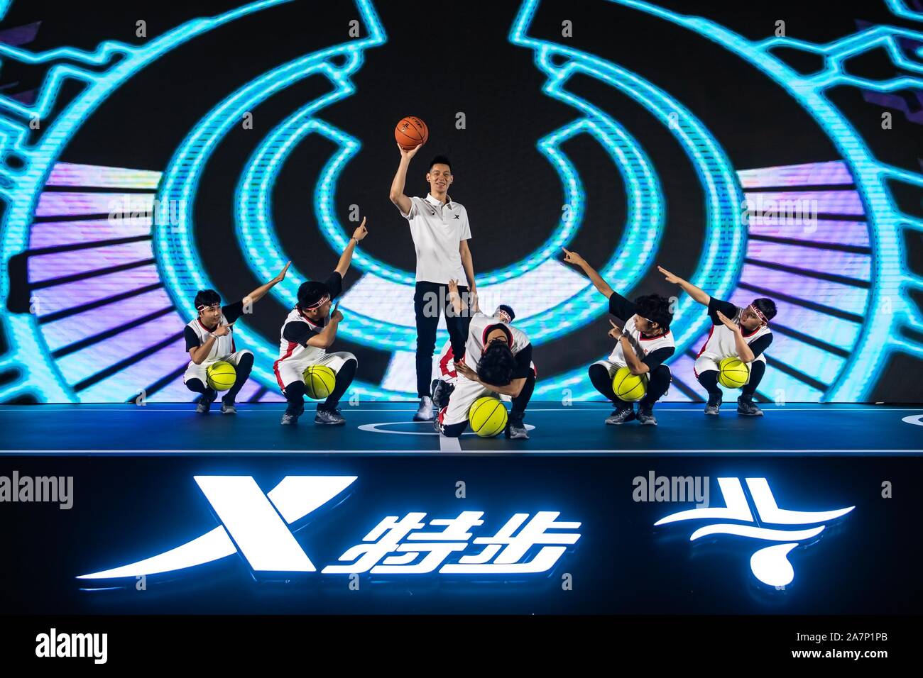 Jeremy Lin, the highest one, poses to take photos in Guangzhou, south ...