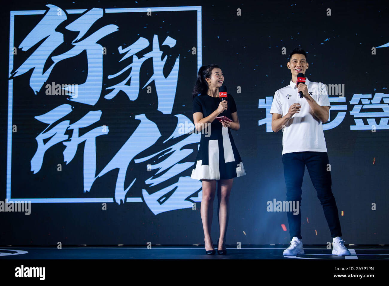 Jeremy Lin, right, delivers a speech in Guangzhou, south China¯s ...