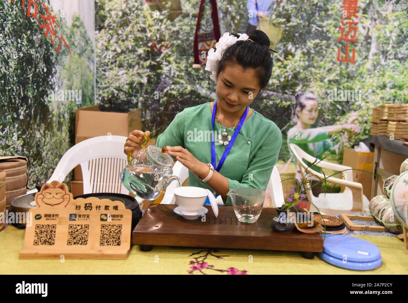A performer shows tea art at the fifth China International Tea Culture ...