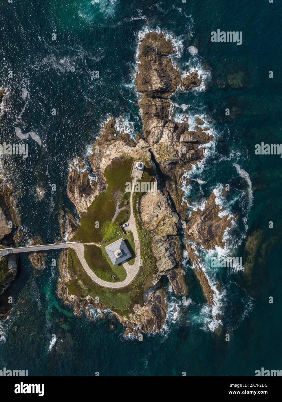 Aerial view of the lighthouse on Pancha island. Northern Spain in ...