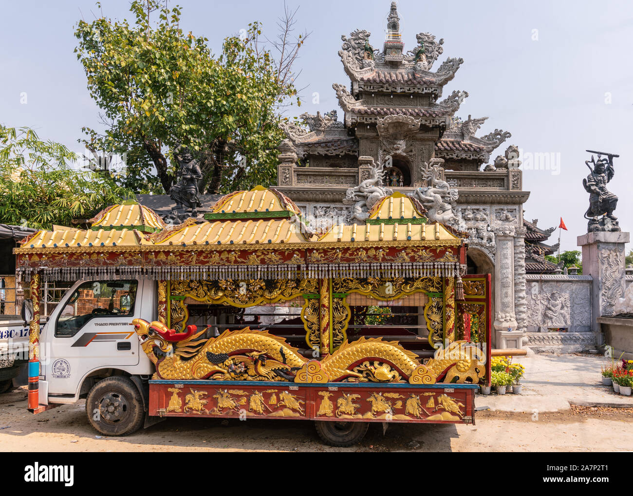 Da Nang, Vietnam - March 10, 2019: Van rebuilt as gold-red hearse with ...