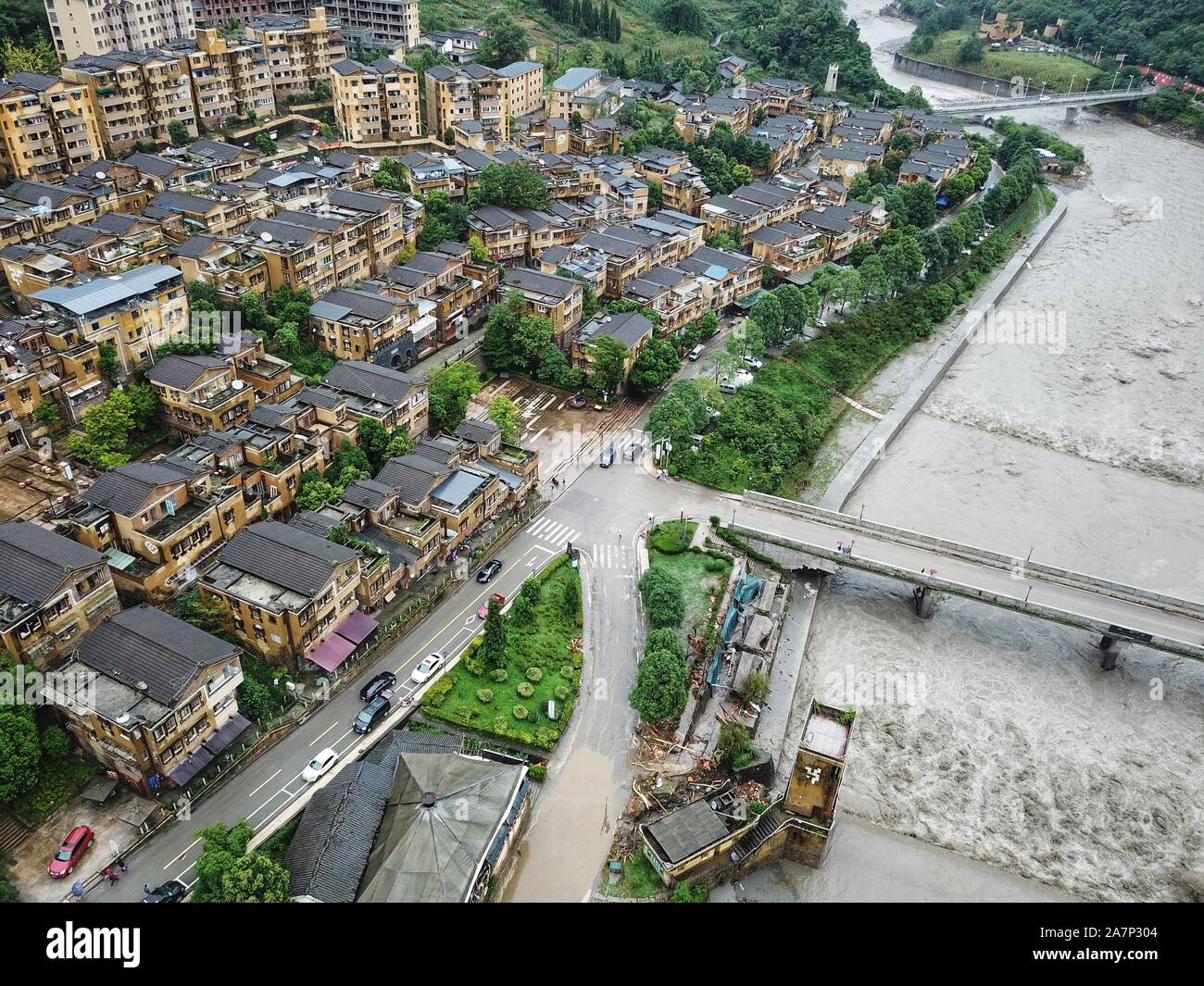 Roads, fields and residential buildings are covered with mud and ...