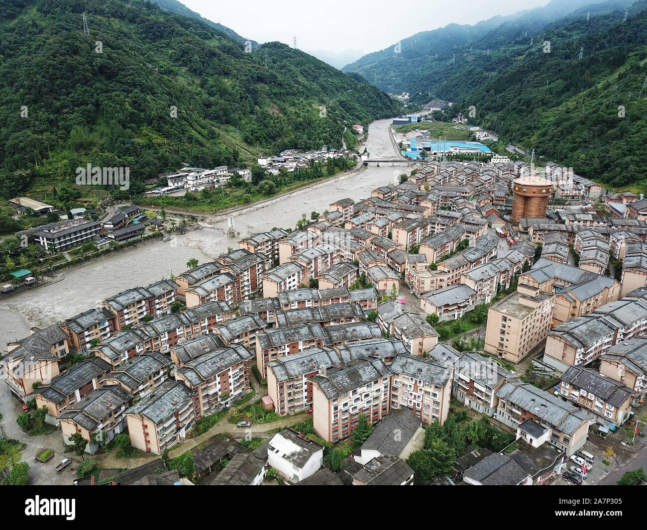 Roads, fields and residential buildings are covered with mud and ...