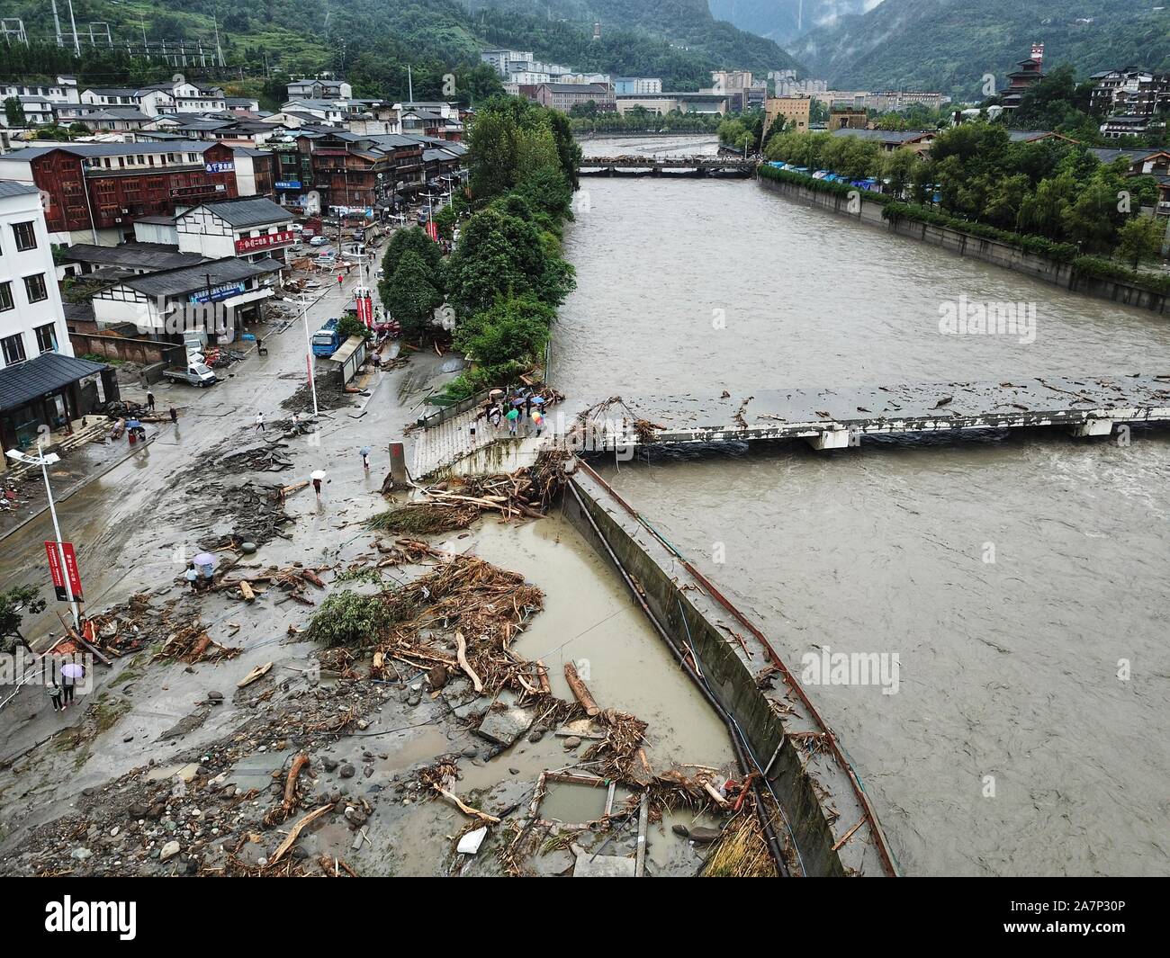 Roads, fields and residential buildings are covered with mud and ...