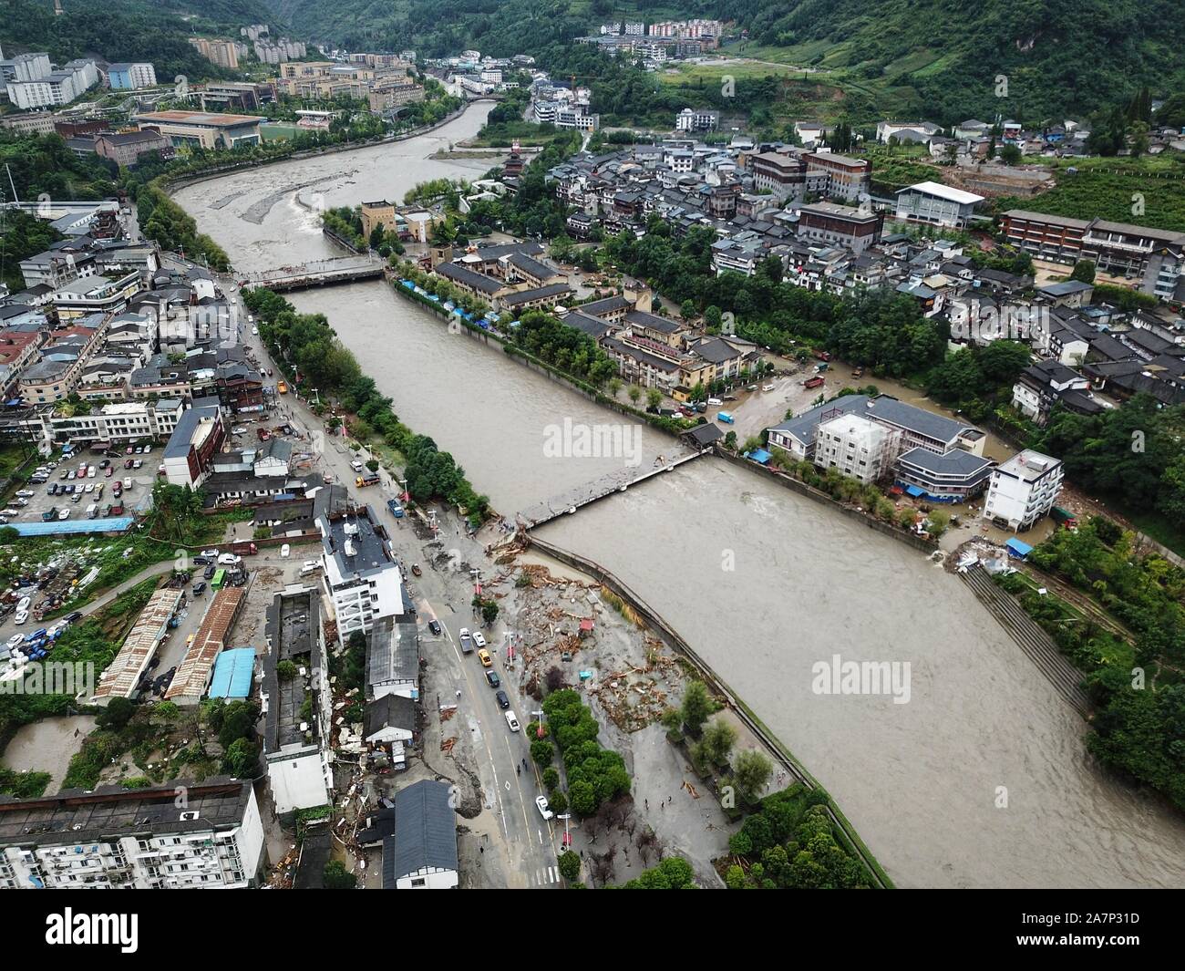 Roads, fields and residential buildings are covered with mud and ...