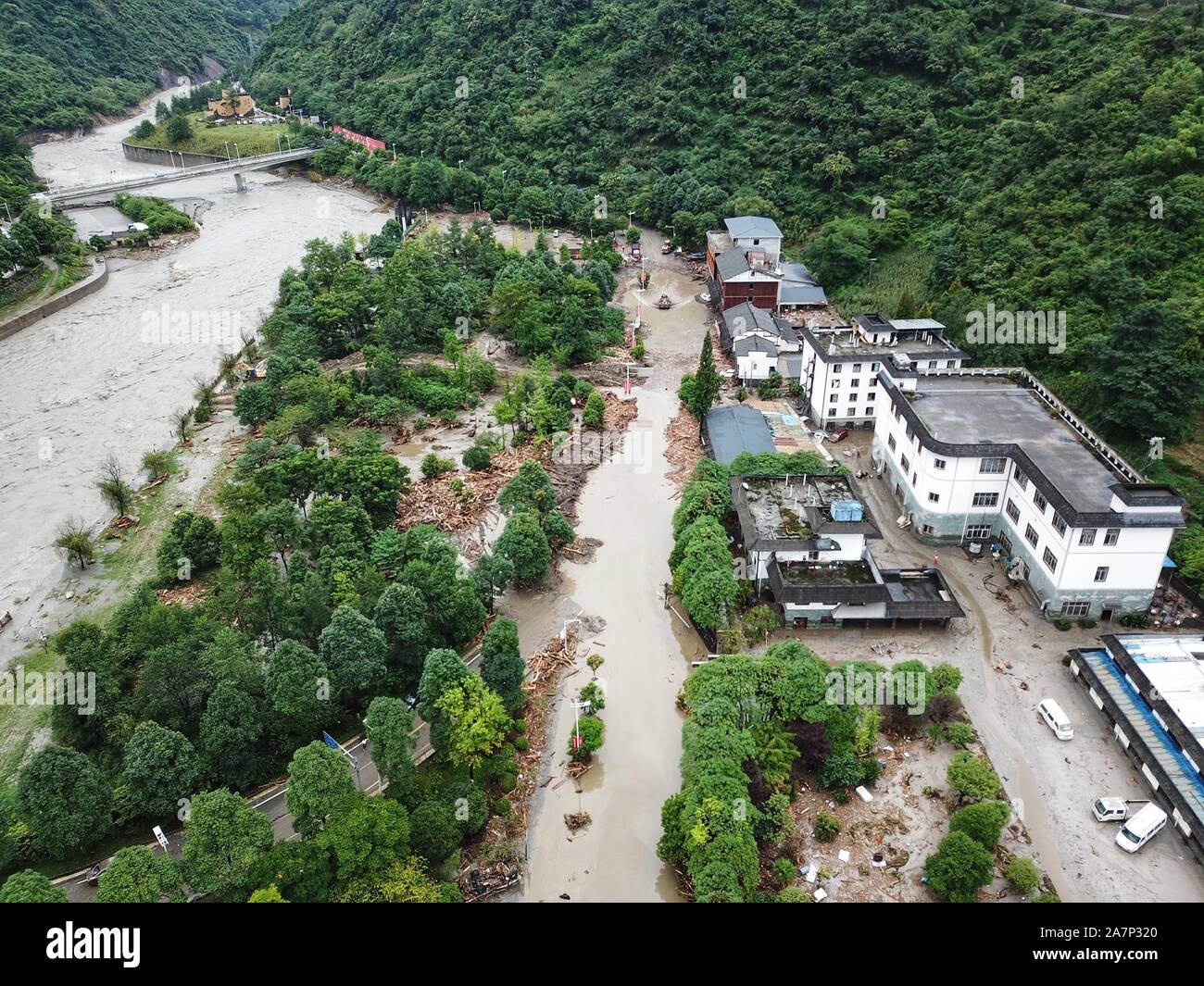 Roads, fields and residential buildings are covered with mud and ...