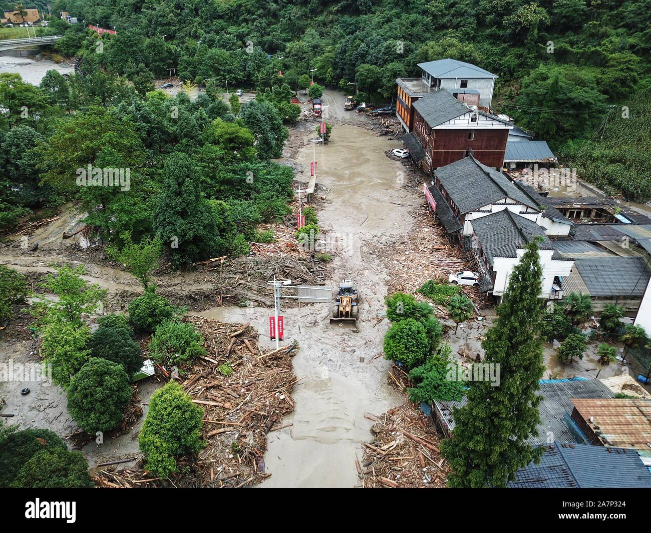 Roads, fields and residential buildings are covered with mud and ...