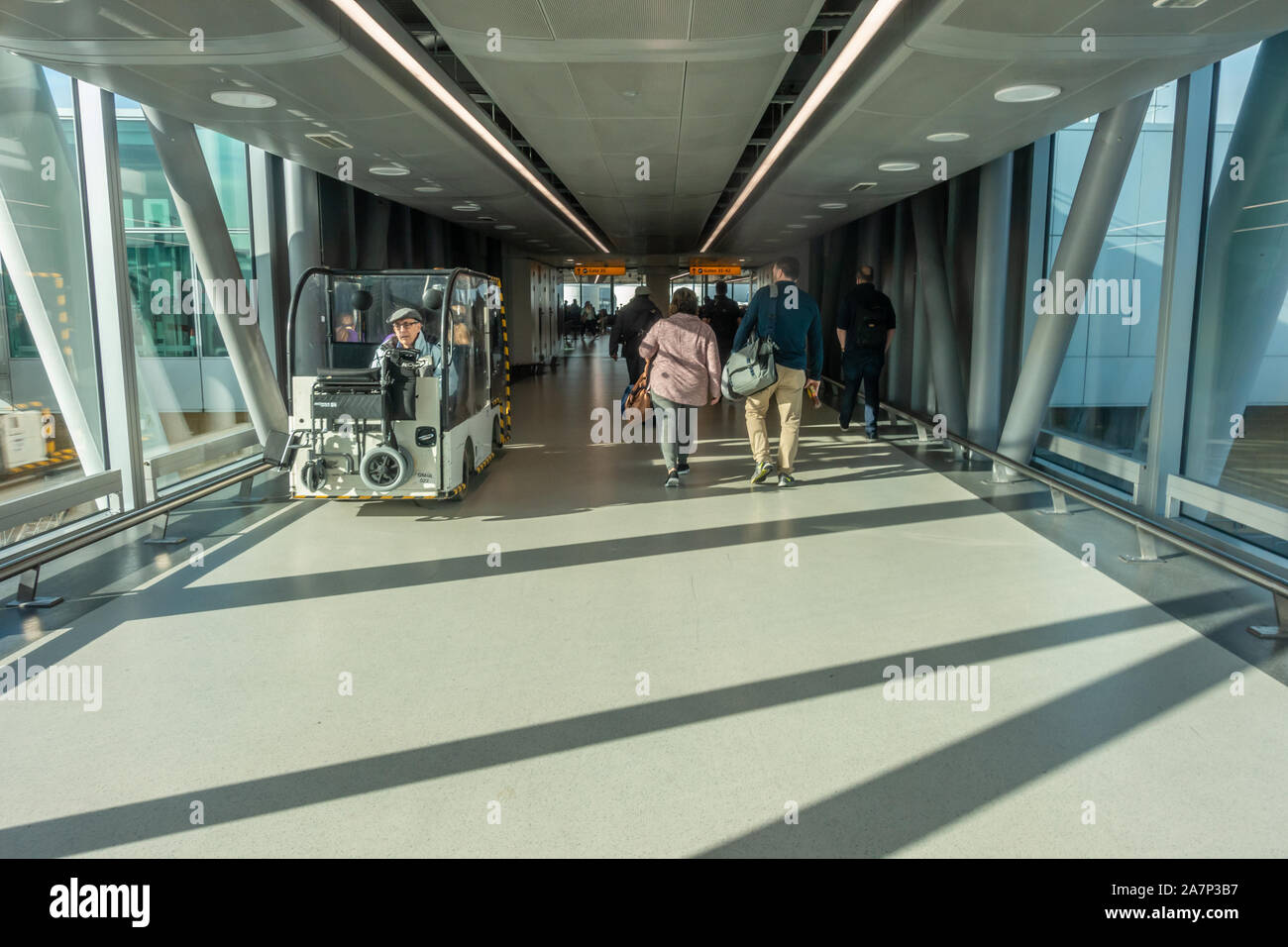 A walkway in Heathrow airport heading towards departure gates Stock ...