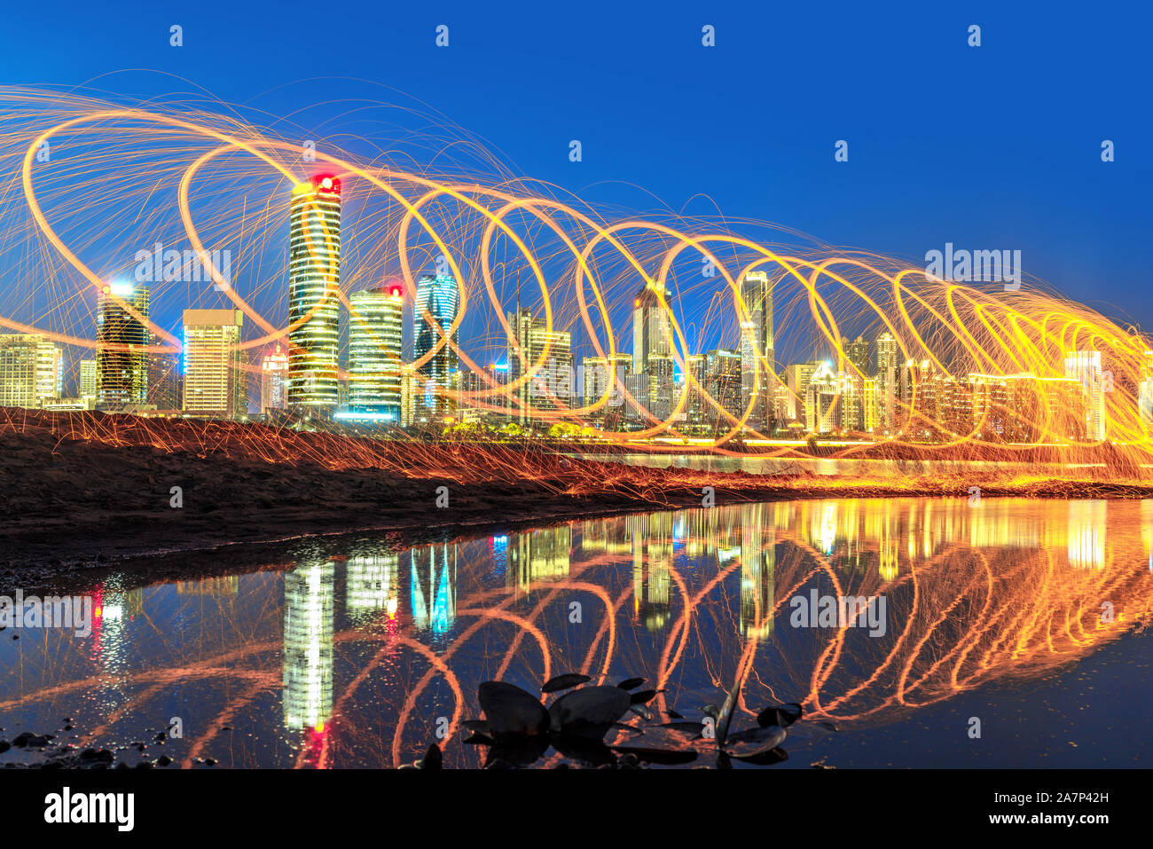 Rotating fire and city night view, Nanchang, China Stock Photo - Alamy