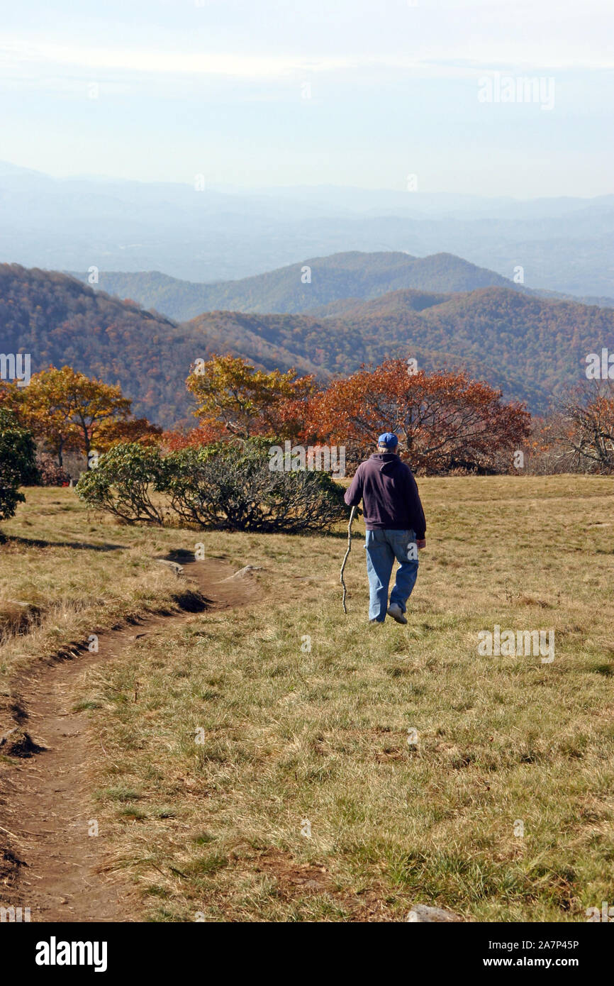Man walking on winding road hi-res stock photography and images - Alamy