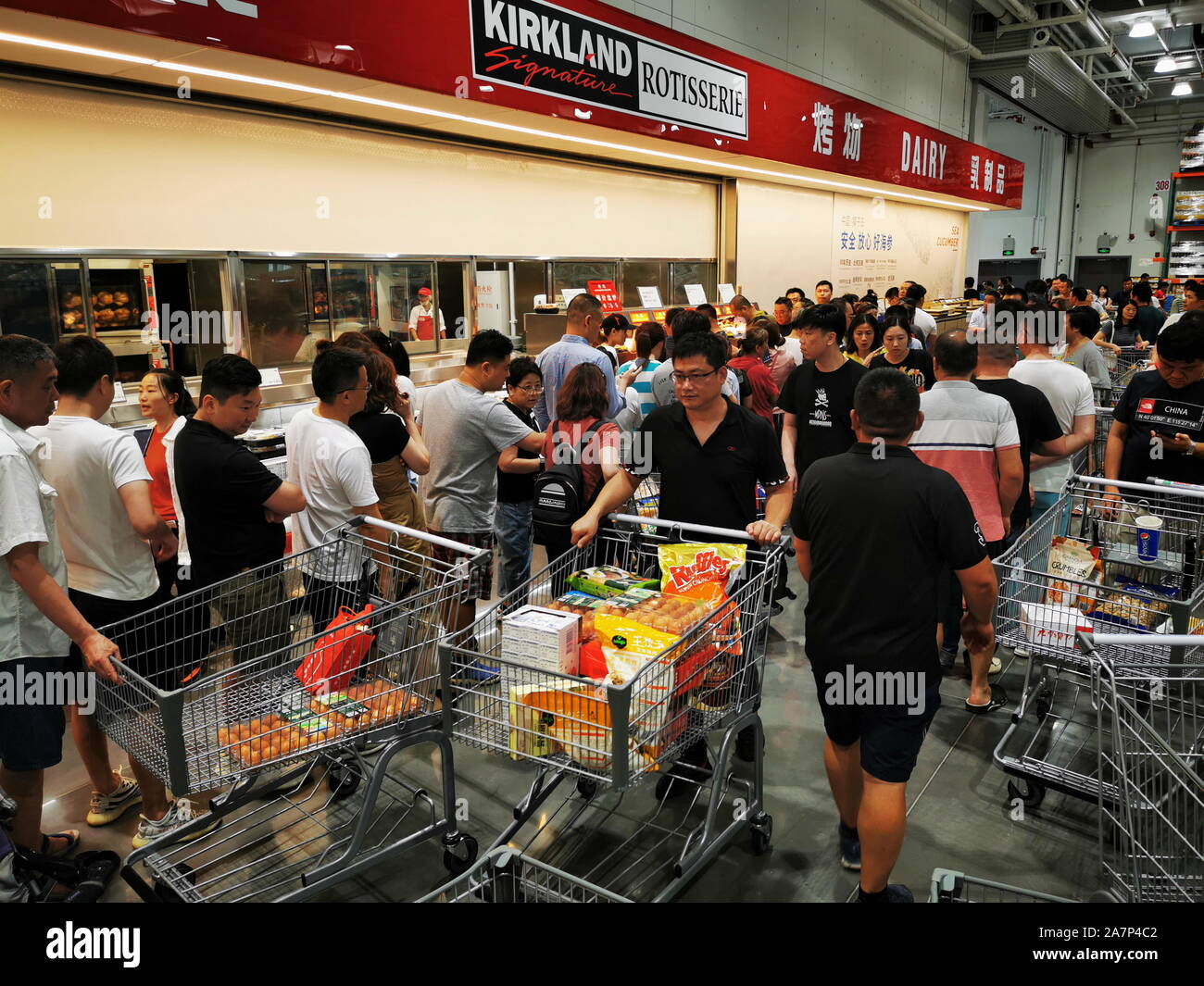 Chinese customers shop at the Costco store in Shanghai, China, 28 ...
