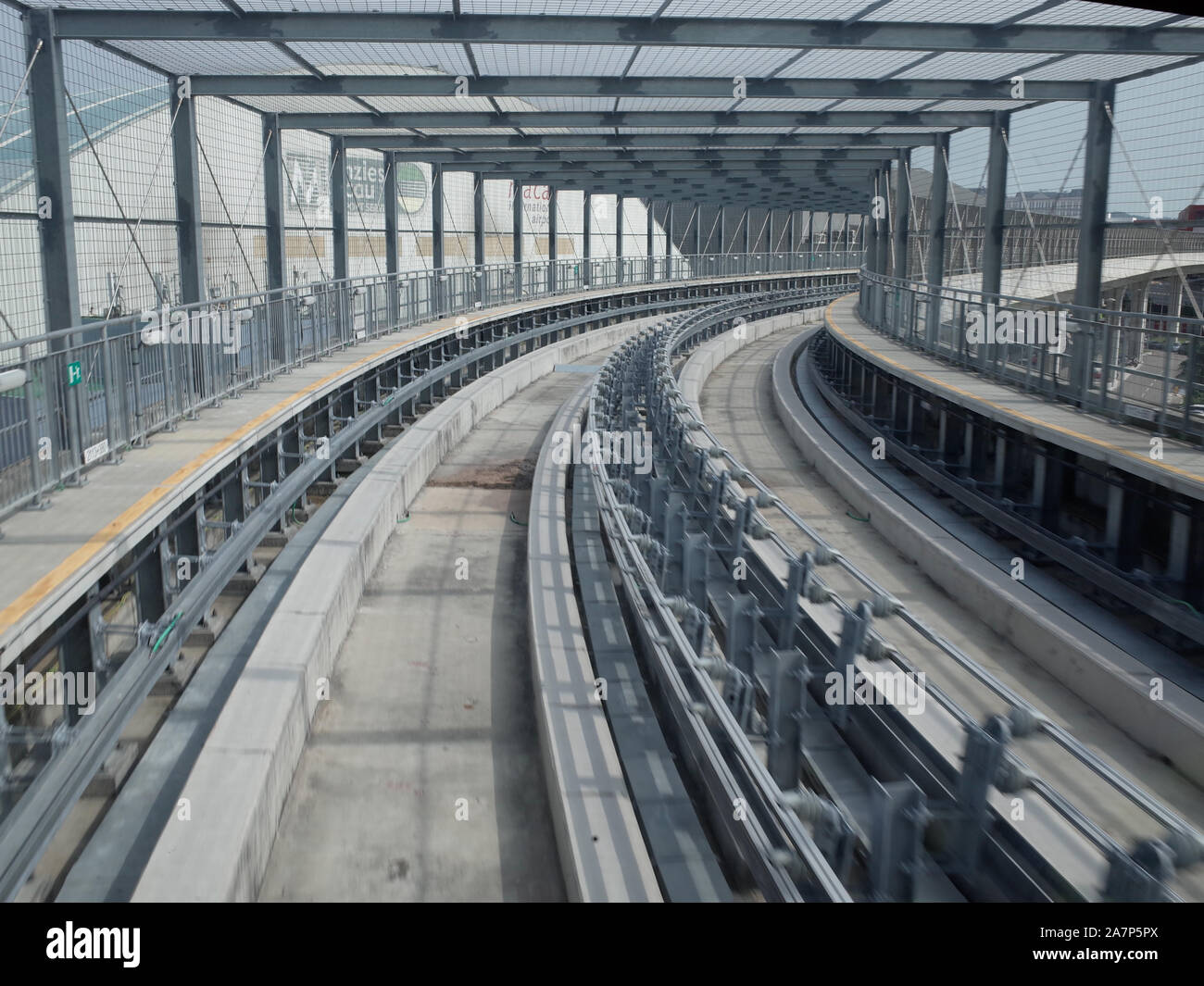 Chinese workers introduce the Light Rail Transit (LRT) system at the ...