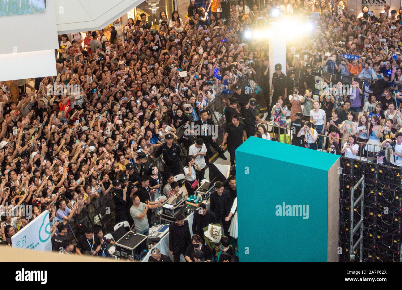 Chinese fans crowd a shopping mall to support singer and actor Karry ...