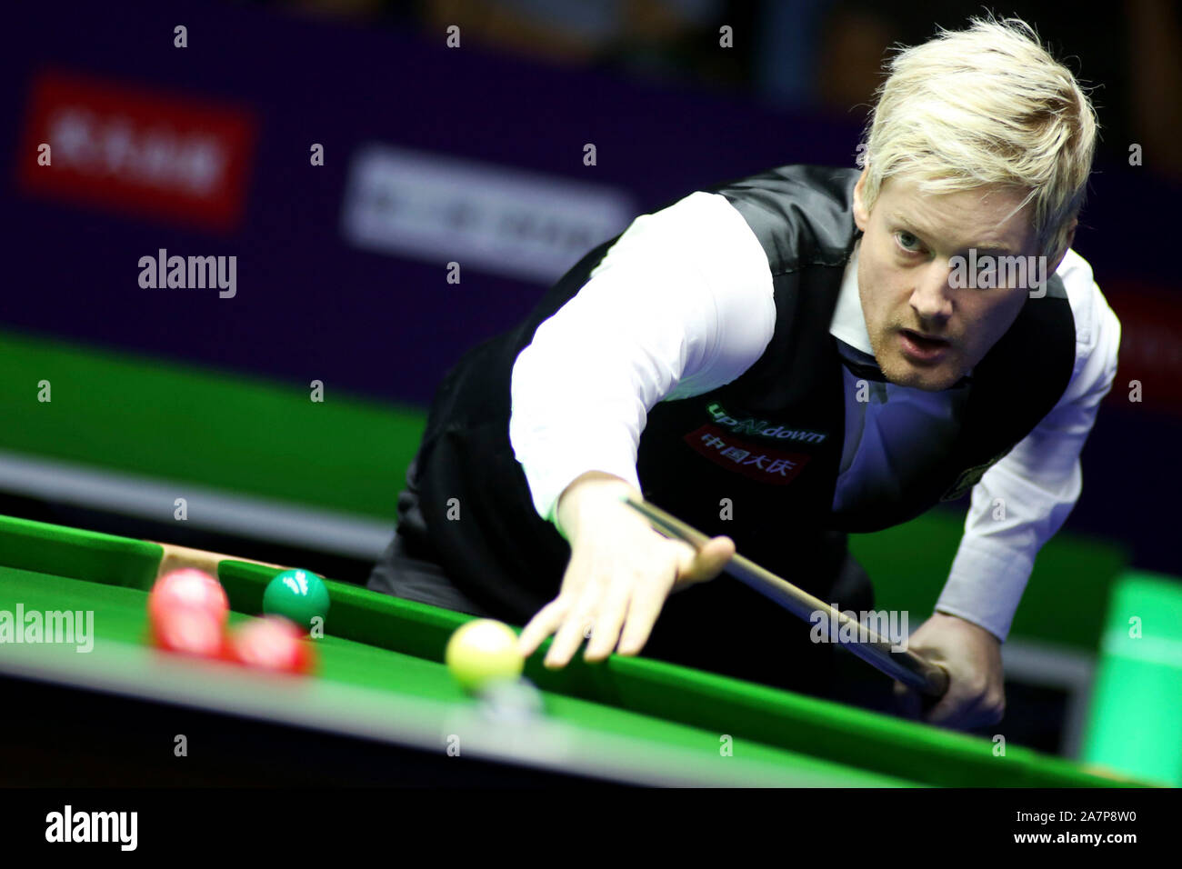 Neil Robertson of Australia considers a shot to Nigel Bond of England ...