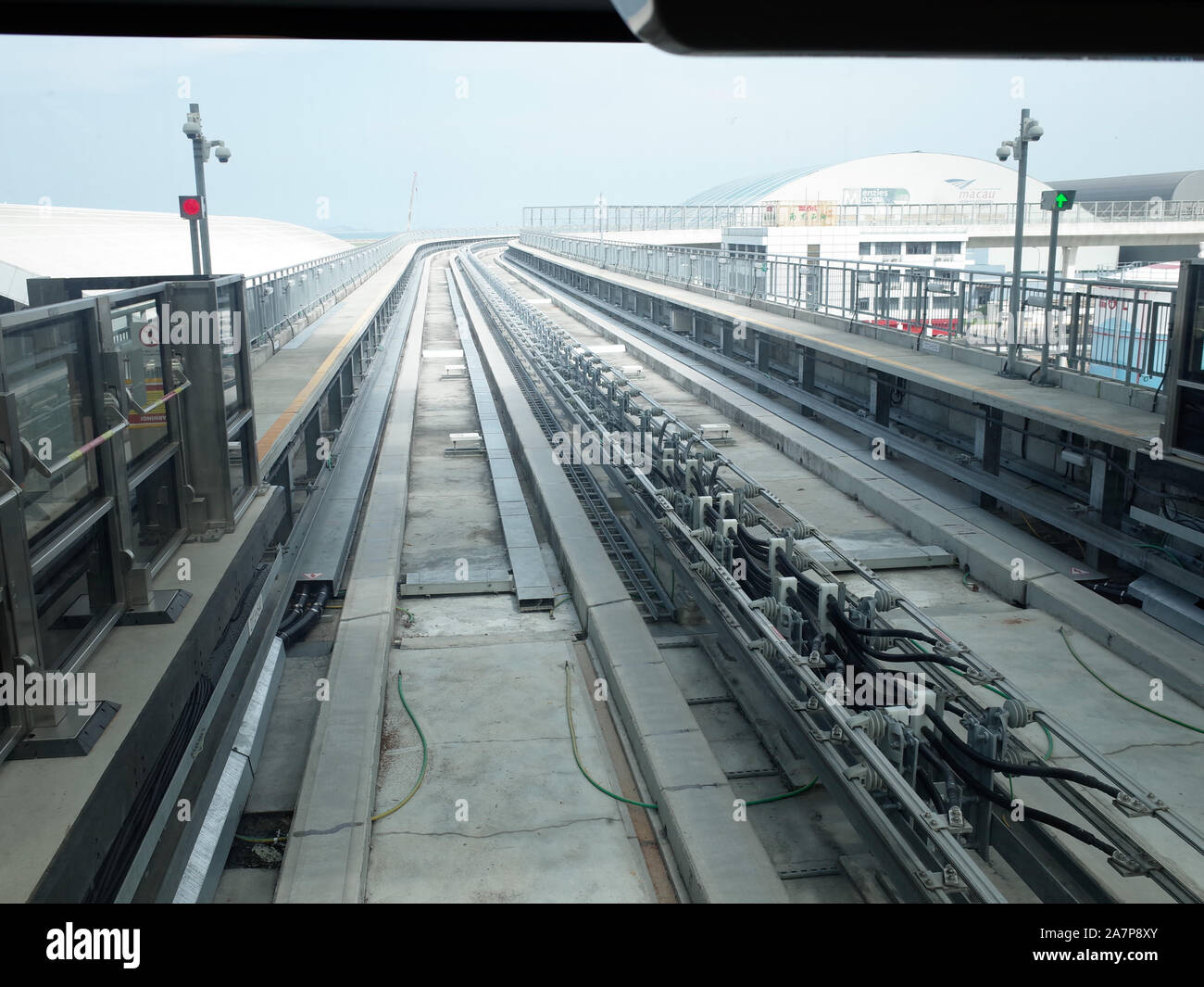 Chinese workers introduce the Light Rail Transit (LRT) system at the ...