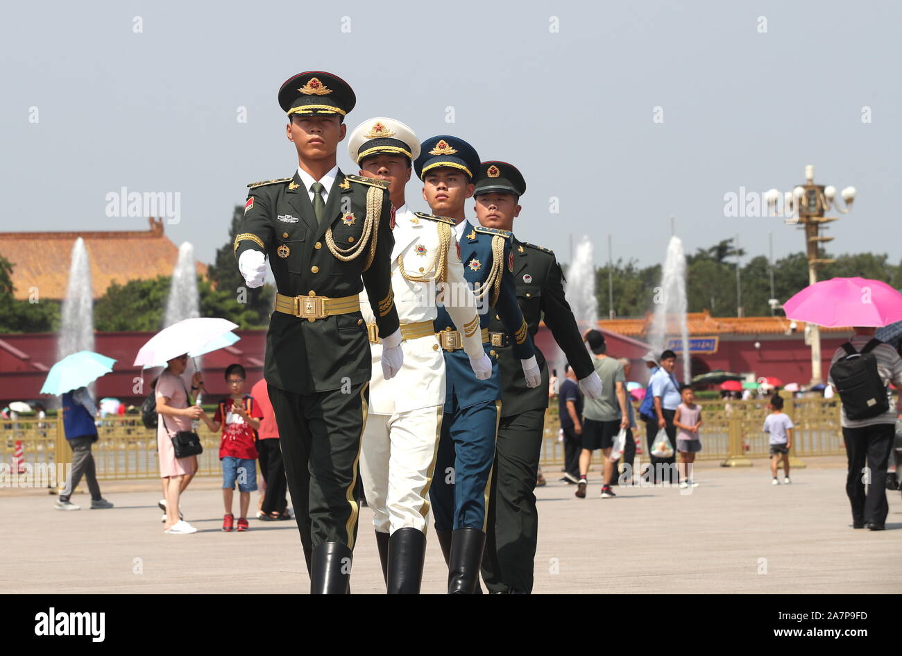 Two soldiers, a sailor and an airman patrol at the Tian'anmen Square to ...