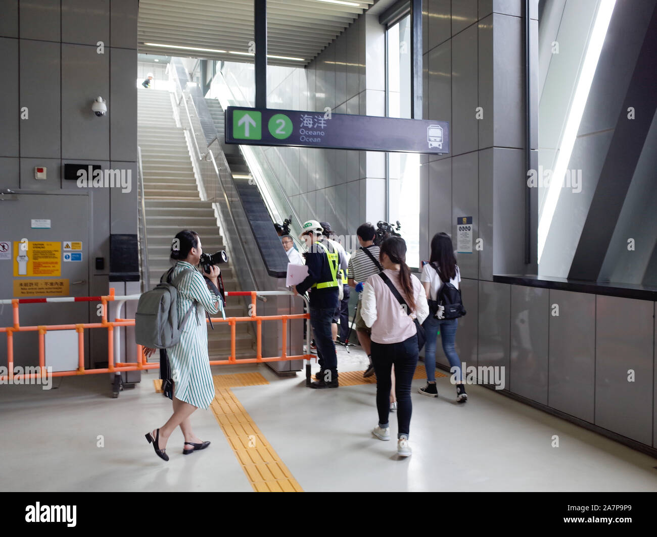 Chinese workers introduce the Light Rail Transit (LRT) system at the ...