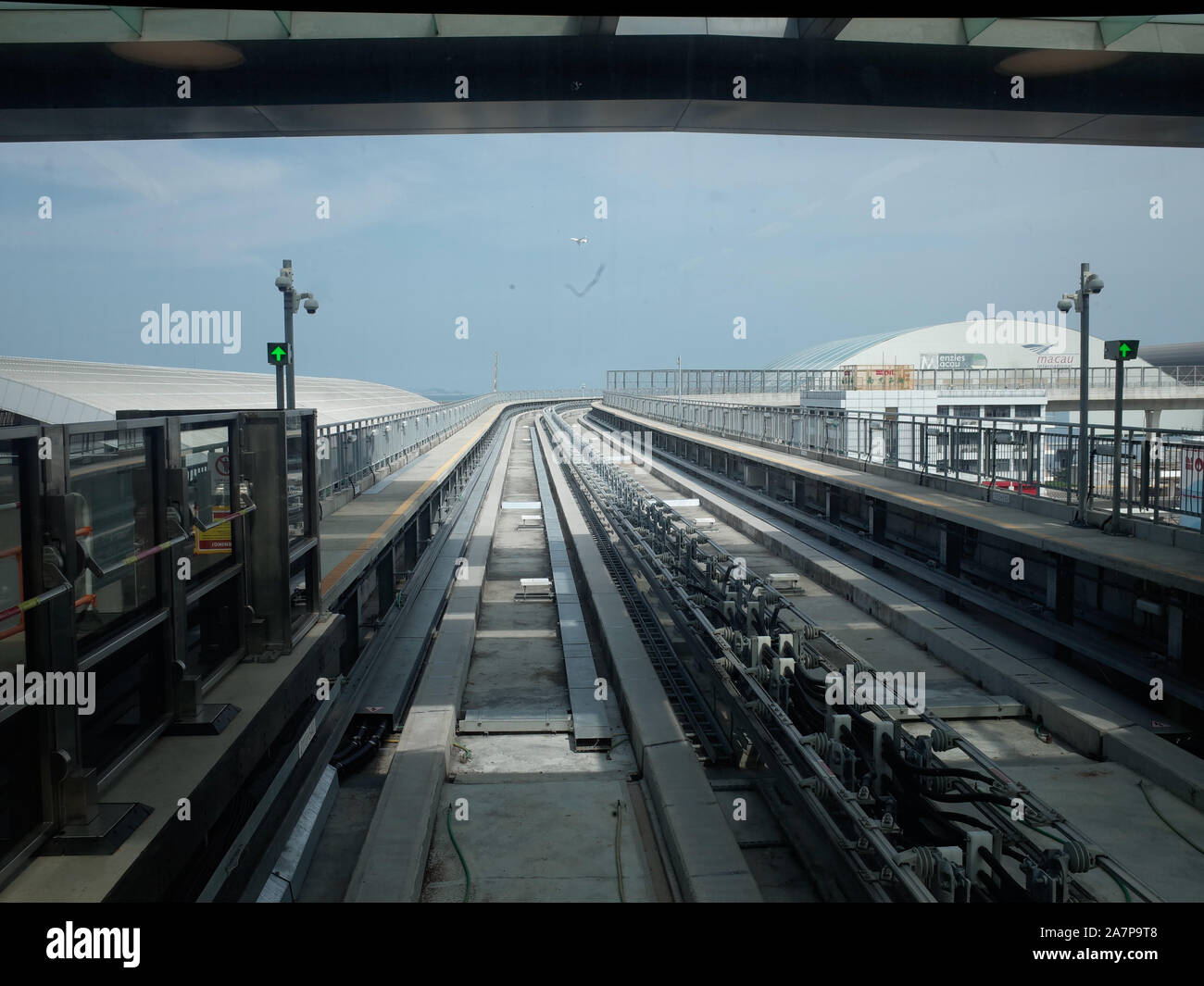 Chinese workers introduce the Light Rail Transit (LRT) system at the ...