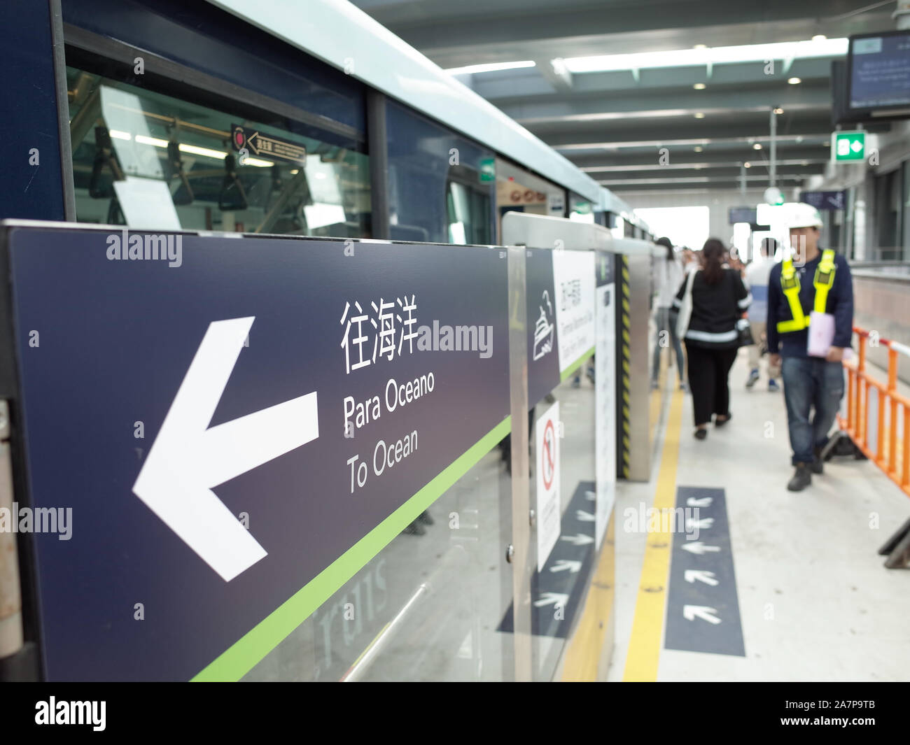 Chinese workers introduce the Light Rail Transit (LRT) system at the ...
