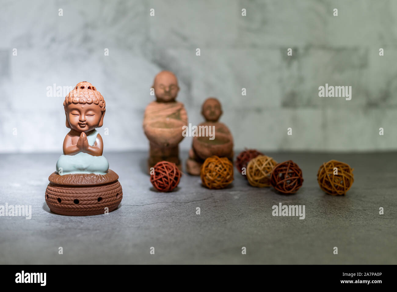 Monk sitting down praying, little monks standing holds bowl statue home ...