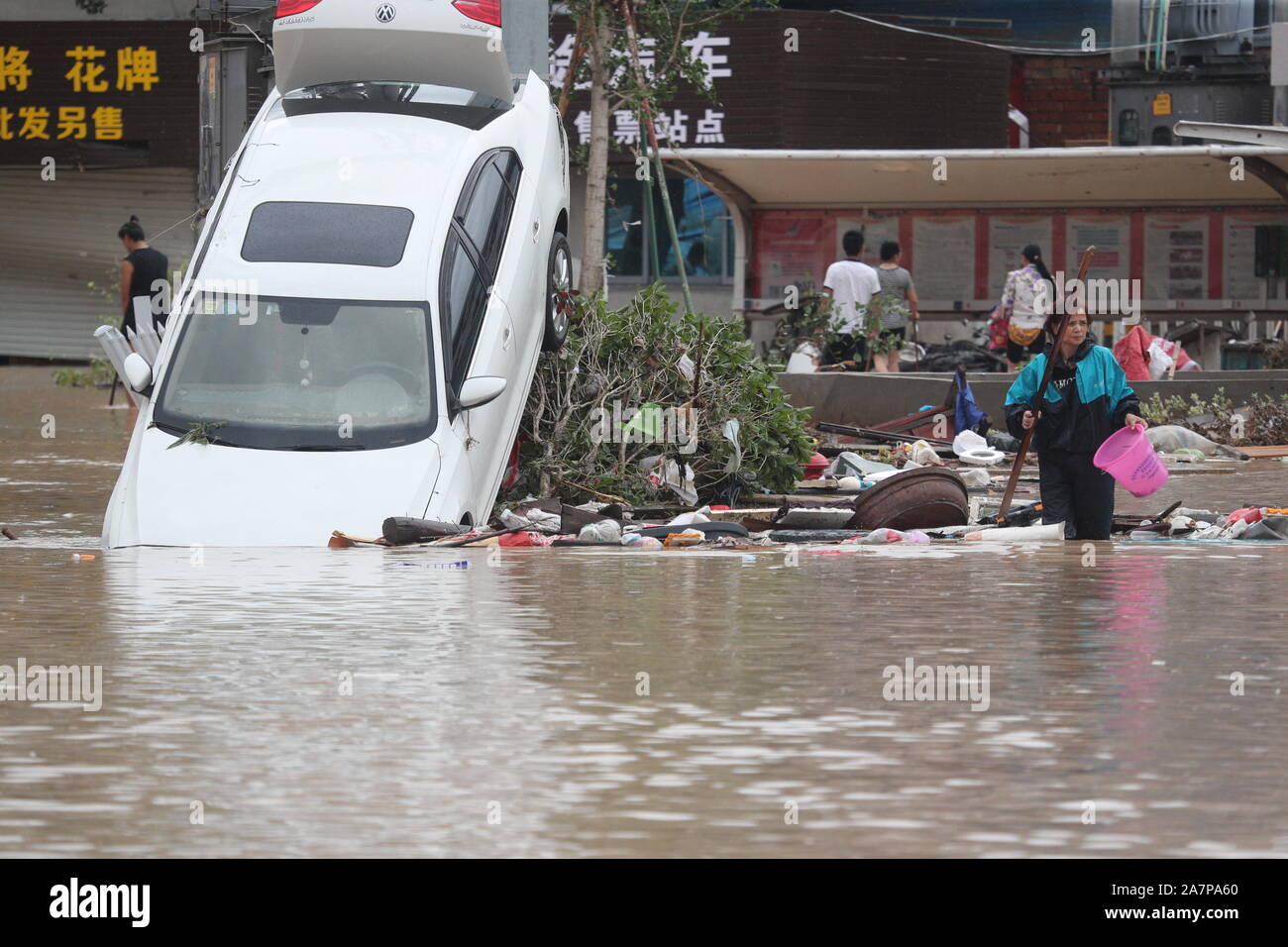 A car is devastated by strong wind and heavy rainstorm caused by ...