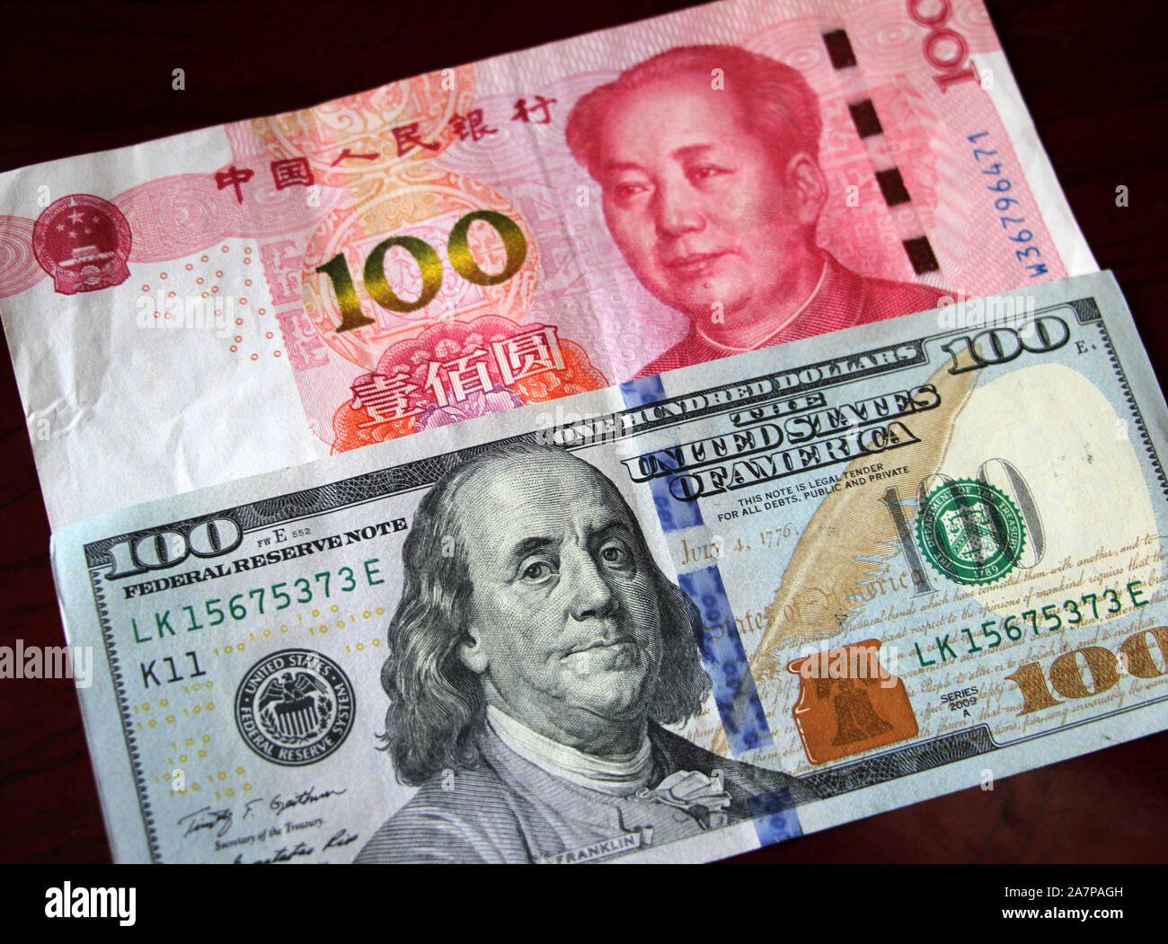 --FILE--In this undated and unlocated photo, renminbi and dollars are ...