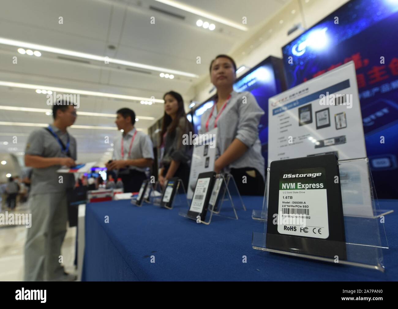 Visitors have a look of exhibited products at Flash Memory World in ...
