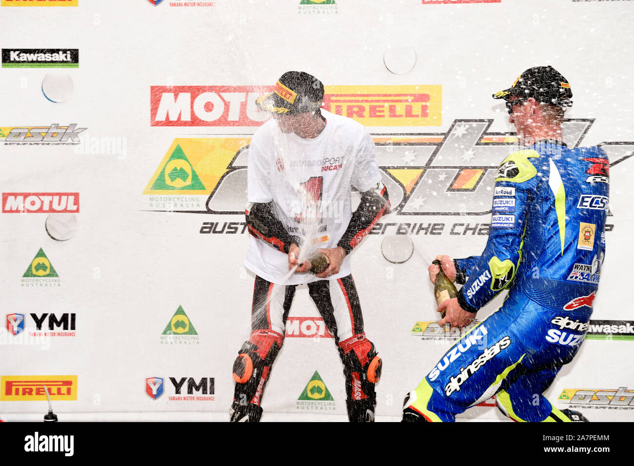 Ducati's Mike Jones is sprayed with champagne by Suzuki rival Wayne ...