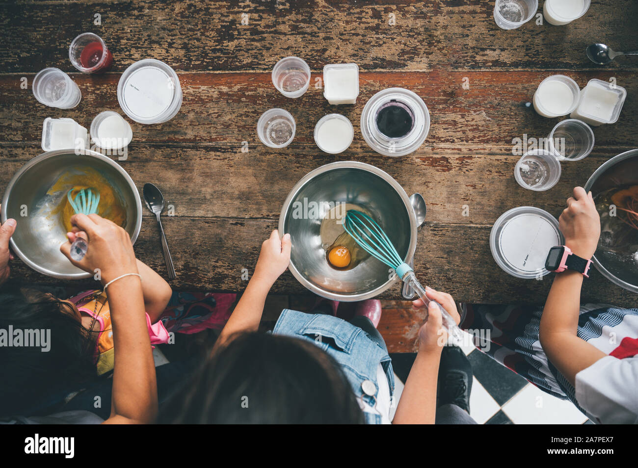 Group of kids are preparing the bakery in the kitchen .Children ...