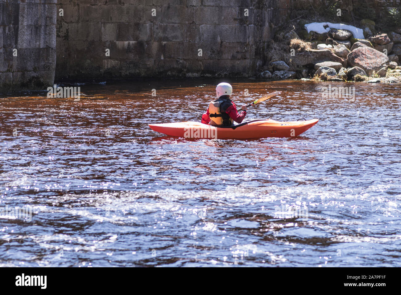Woman on the kayak.Woman on the bank of the river are resting pouring ...